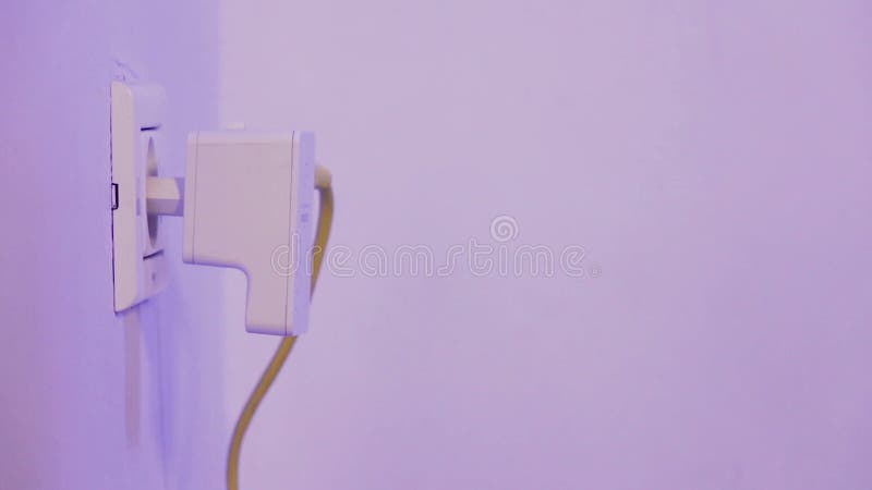 Man Insert Ethernet Cable into WiFi Extender Device Which is in ...