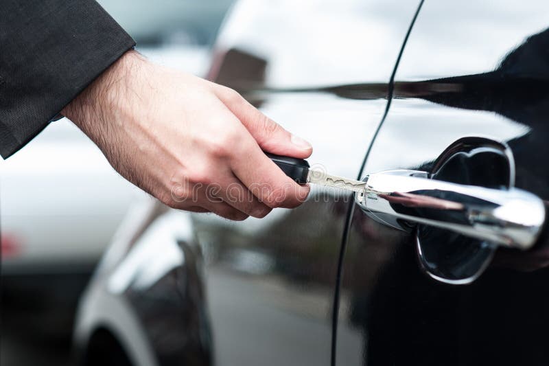 Man Unlocking Car Door. stock photo. Image of people - 27052552