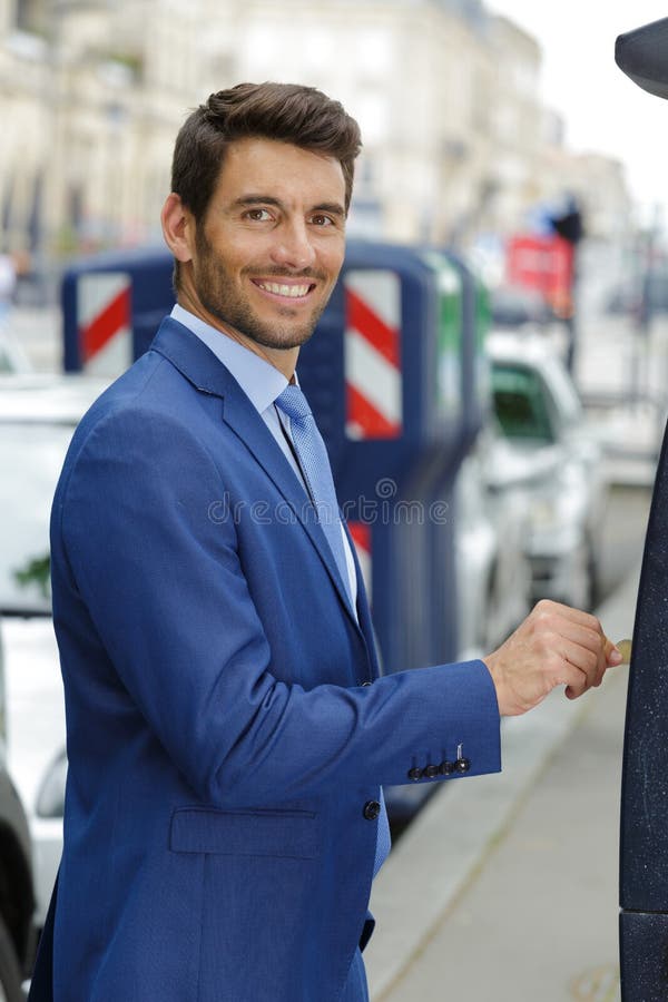 Man Inserting Coin in Vending Ticket Machine Stock Image - Image of ...