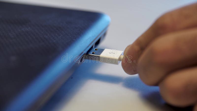 Hand Inserting White USB Cable into Laptop Isolated on White Background ...