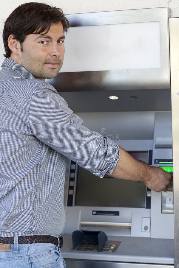 Man Inserts Card in the ATM Stock Photo - Image of money, capital: 25145980