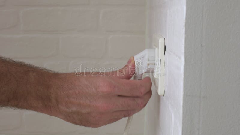 Man Plugging a Socket Video Stock Video - Video of power, wall: 260875023