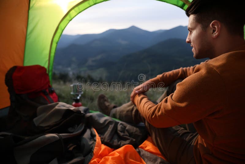 Man Inside of Camping Tent in Mountains Stock Image - Image of fall ...