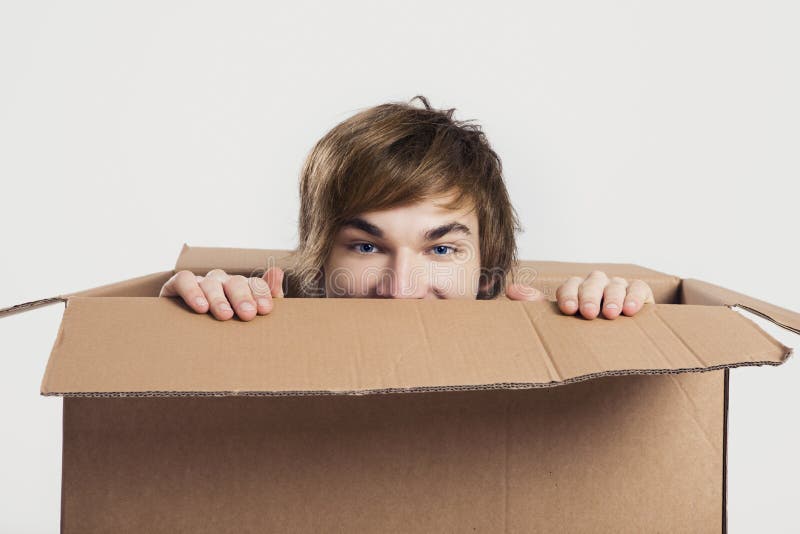 Man inside a card box stock photo. Image of hiding, grimace - 27691030