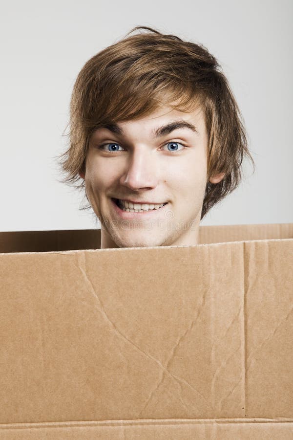 Man inside a card box stock photo. Image of cardboard - 32445582