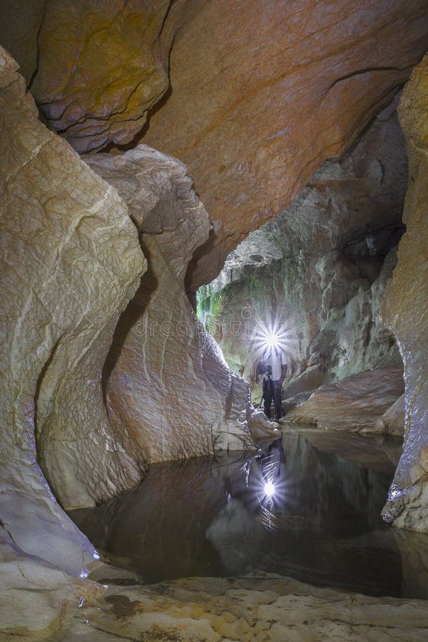 Man Inside Cave with Headlight Stock Photo - Image of magic, black ...