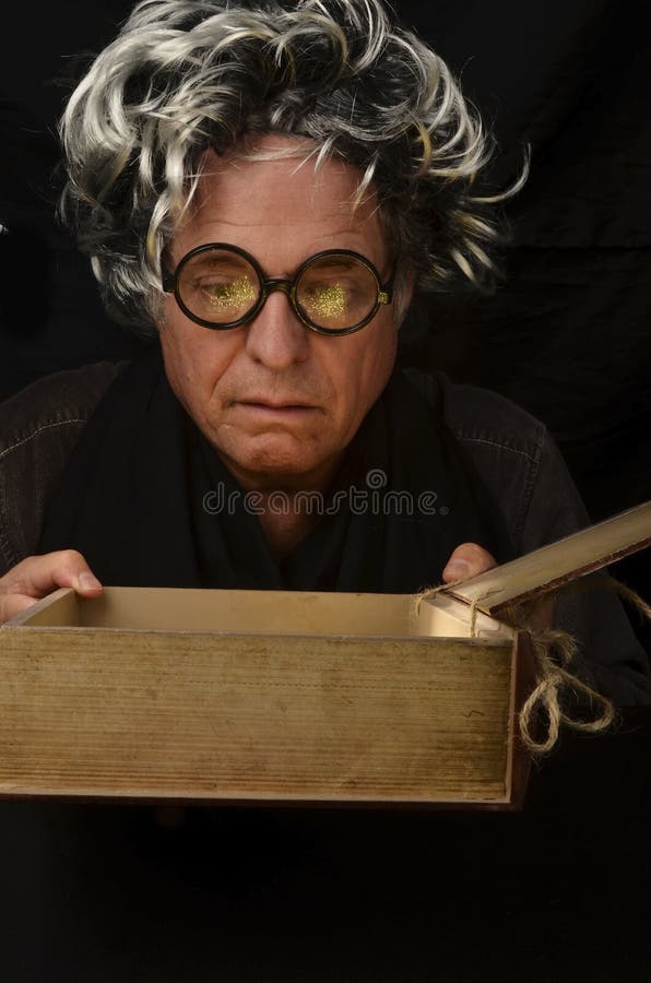 Man Inspecting an Ancient Box Stock Photo - Image of reading, wisdom ...