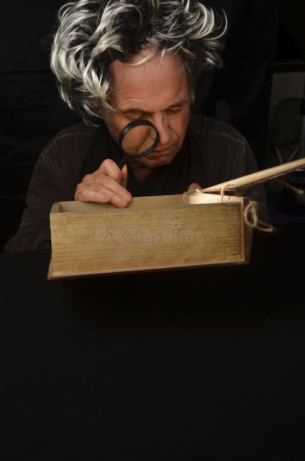 Man Inspecting an Ancient Box Stock Image - Image of learning, people ...
