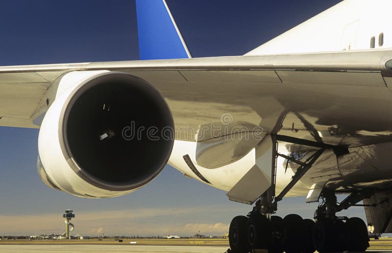 Man Inspecting Engine of Passenger Jet Stock Image - Image of standing ...
