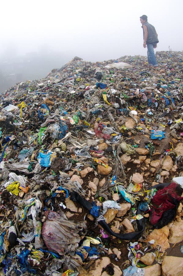 Man Inspecting an Mountain of Trash Editorial Stock Image - Image of ...