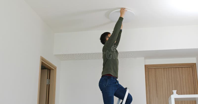 Man Install Lamp Onto Ceiling at Home Stock Image - Image of bulb ...