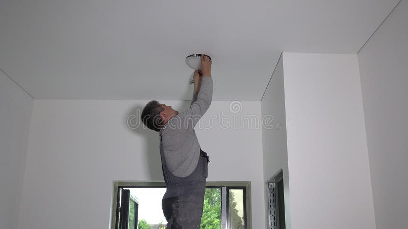 Man Install Led Light Lamp into Ceiling Hole Stock Footage - Video of ...