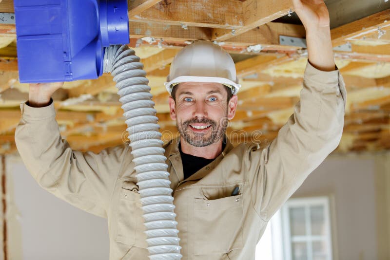 Man during Installation Ventilation Pipes Stock Image - Image of ...