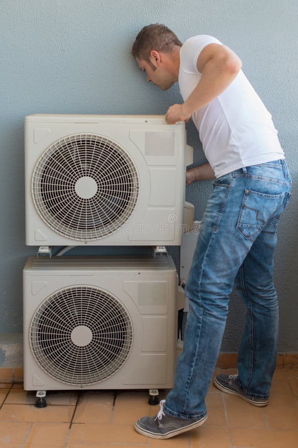 Man Installing Air-conditioning System. Stock Image - Image of ...