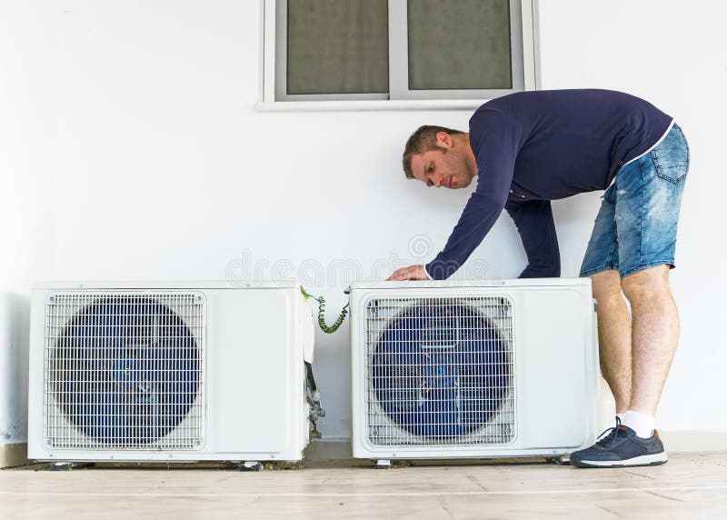 Man Installing Air-conditioning System Stock Photo - Image of electric ...