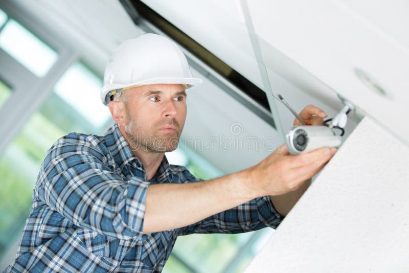 Man installing cctv camera stock photo. Image of theft - 174512742