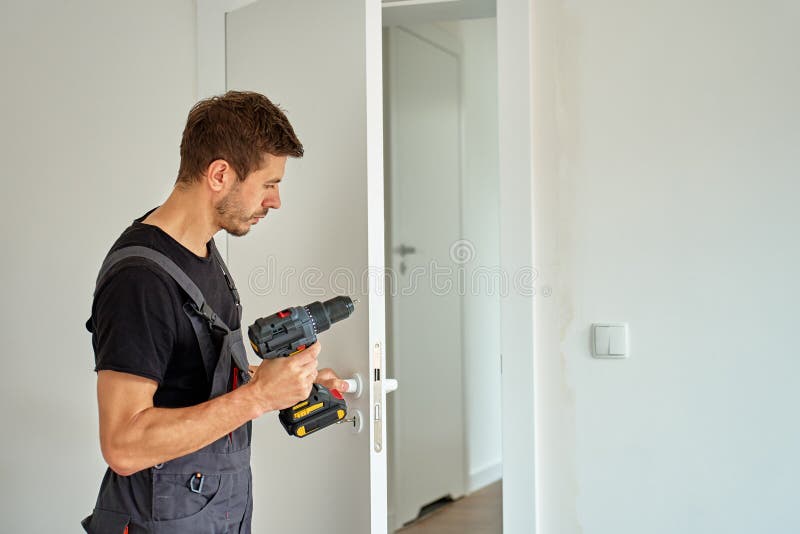 Man Installing Interior Door with Power Drill Stock Photo - Image of ...