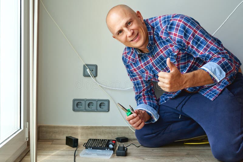 Man Installing Light Switch after Home Renovation. Stock Photo - Image ...