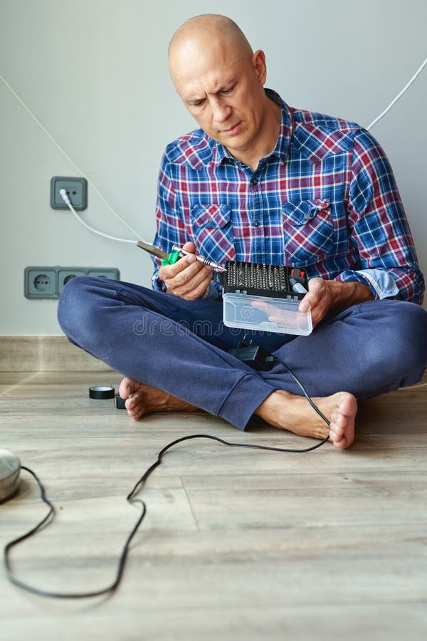 Man Installing Light Switch after Home Renovation. Stock Photo - Image ...