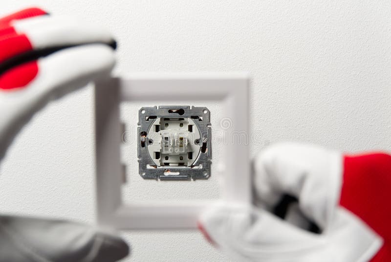 Electrician Installing Light Switch on Painted Wall with Screwdriver ... Electrician Installing Light Switch on Painted Wall with Screwdriver ...
