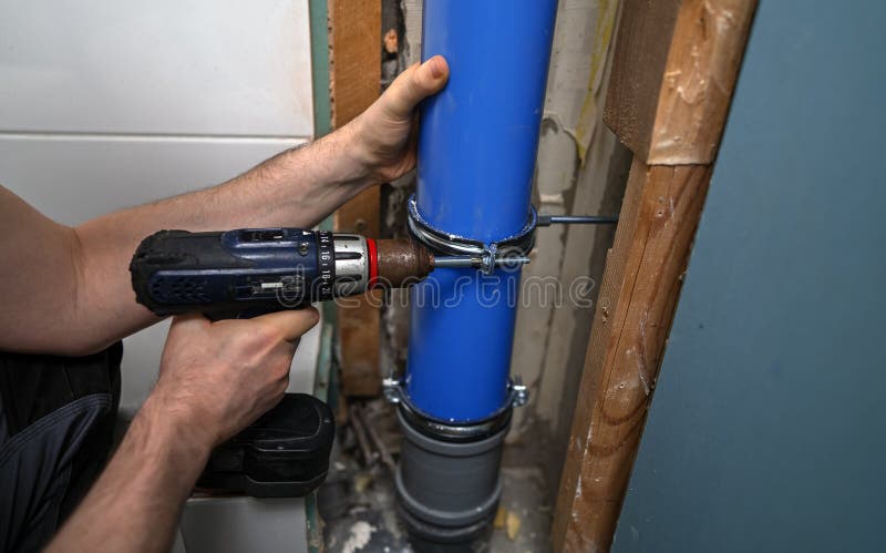 A Man Installing a New Sewer Stack Stock Photo - Image of public, male ...