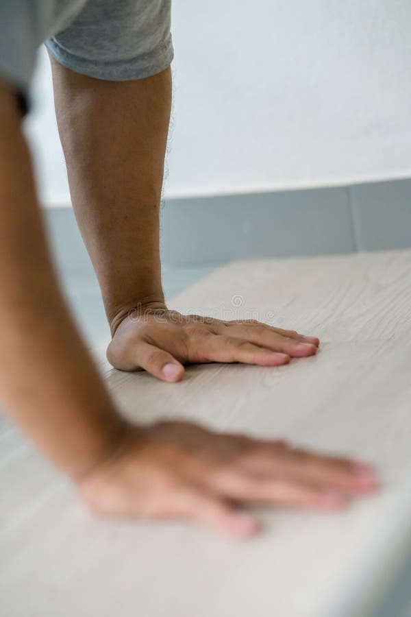 A Man Installing New Vinyl Tile Floor, a DIY Home Project Stock Photo ...