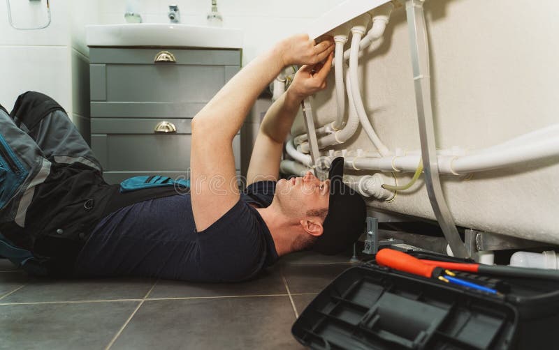 Man Installing Pipe System of Bathtub Stock Image - Image of interior ...