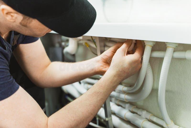 Man Installing Pipe System of Bathtub Stock Photo - Image of installing ...