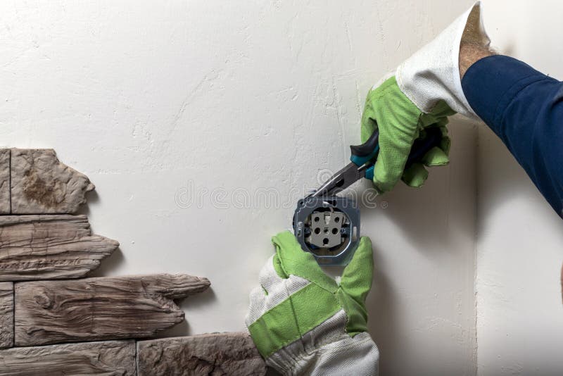 Man Installing Power Outlet after Home Renovation. Electrician ...