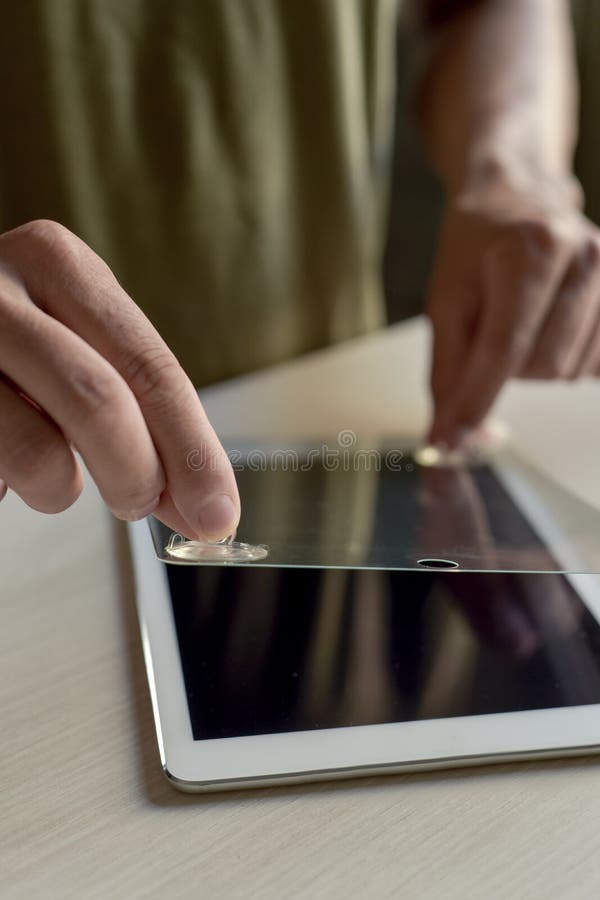 Man Installing a Screen Protector in a Tablet Stock Image - Image of ...