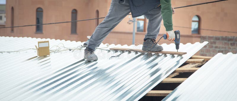 Man Installing of Sheets of Metal Tiles of Roof Stock Image - Image of ...