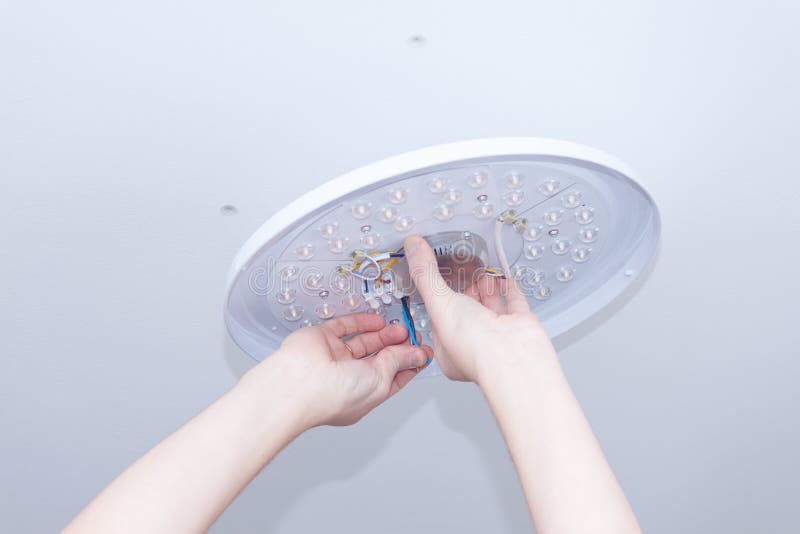 A Man is Installing a Smart Led Ceiling Light Stock Photo - Image of ...