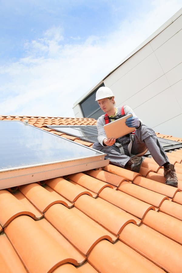 Man Installing Solar Panels on Roof Stock Photo - Image of electric ...