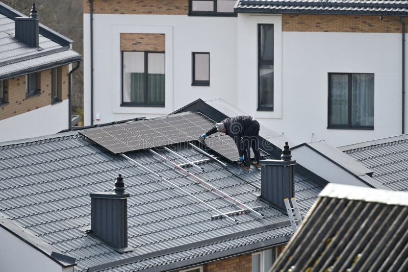 Man Installing Solar Panels on the Roof Editorial Photography - Image ...