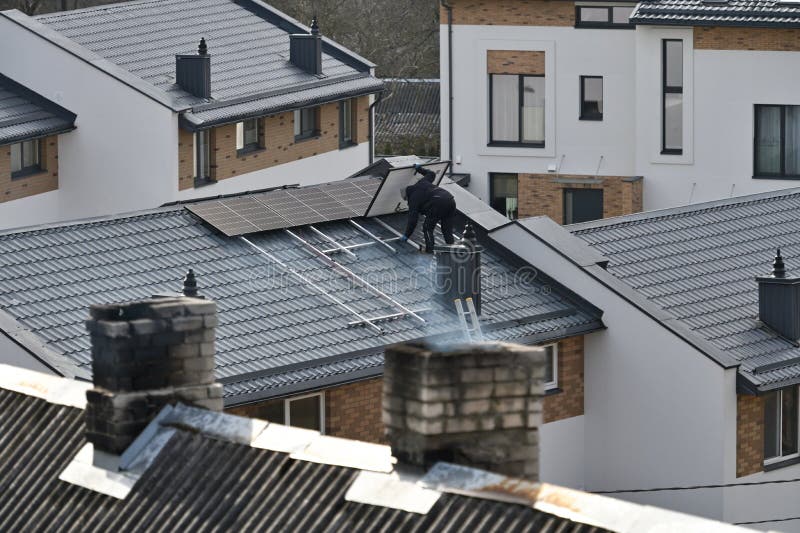Man Installing Solar Panels on the Roof Editorial Stock Photo - Image ...