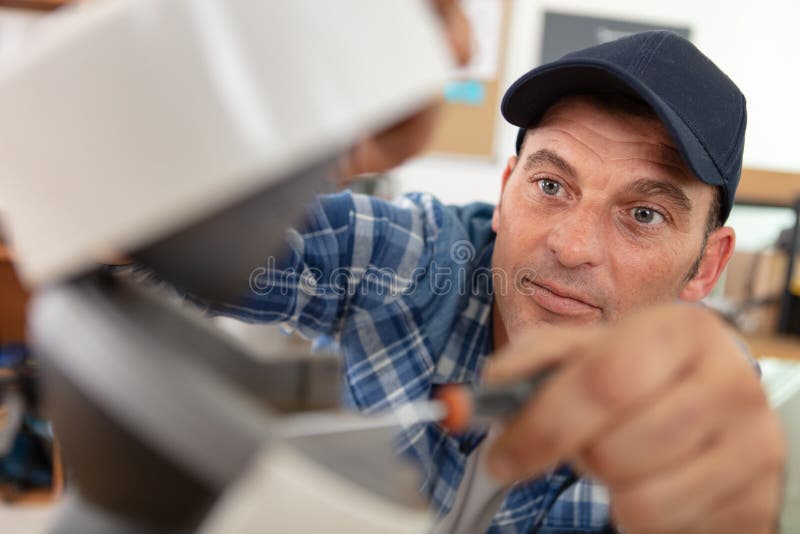 Man Installing Something with Tools Stock Image - Image of construction ...