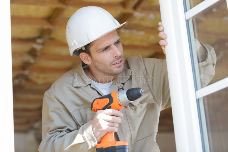 Man installing window stock image. Image of toughness - 186441873