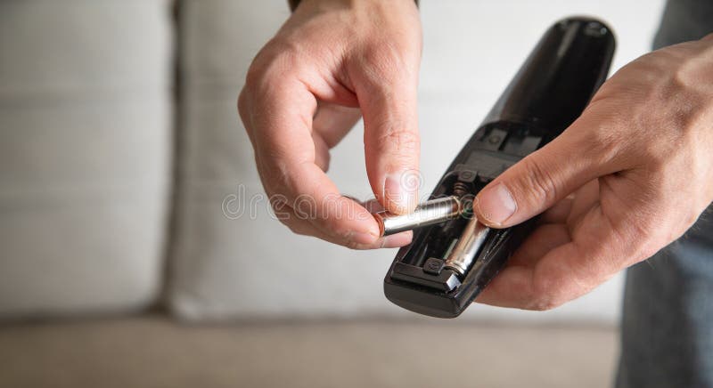 Man Installs a New Battery in the Remote Control of a TV Stock Image ...