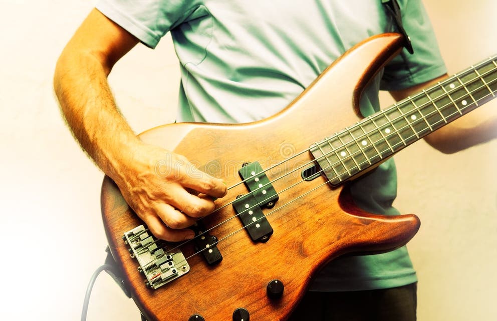 Man and instrument stock photo. Image of light, bass - 25110238