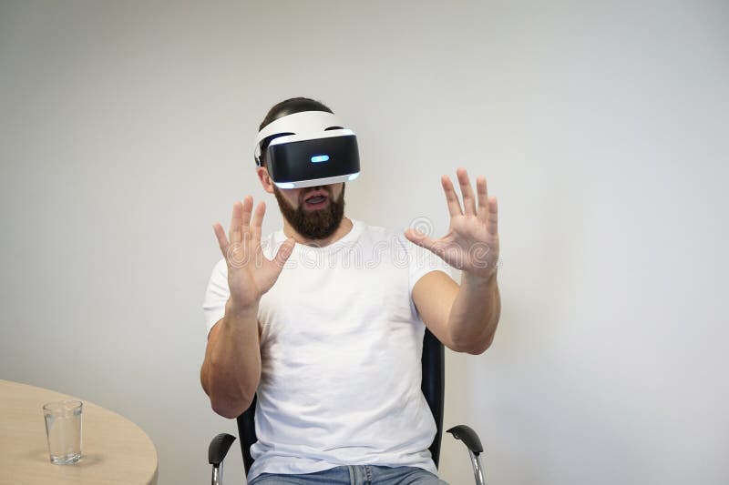 Man Interacting with Virtual Content Using a VR Headse Stock Photo ...