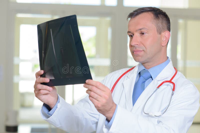 Man interpreting result stock photo. Image of surgeon - 267207766