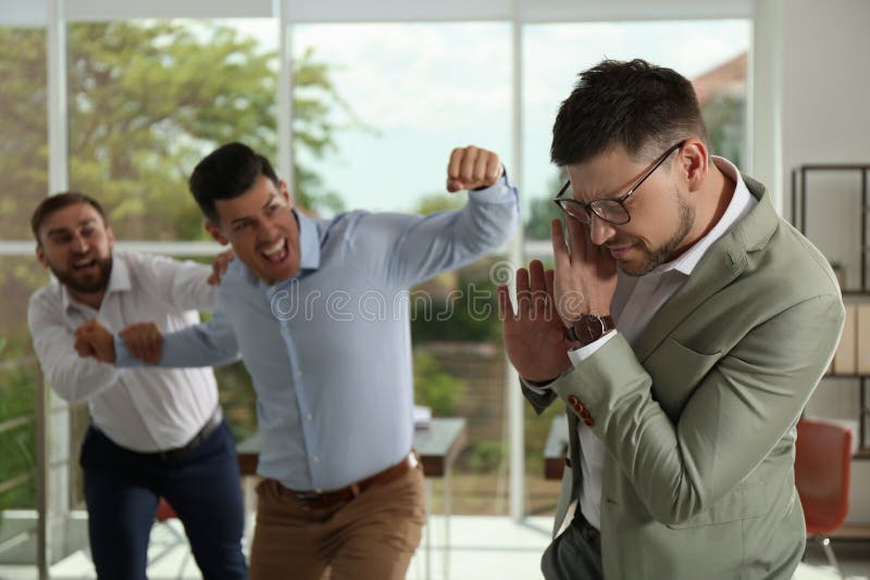 Man Interrupting Colleagues Fight at Work in Office Stock Photo - Image ...