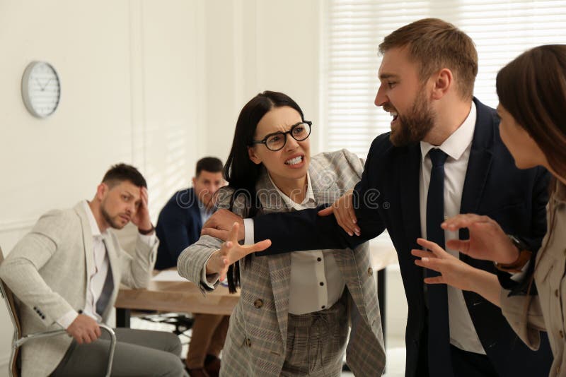 Man Interrupting Colleagues Fight at Work Stock Photo - Image of ...