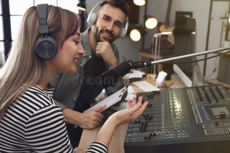 Man Interviewing Young Woman in Modern Radio Studio Stock Photo - Image ...