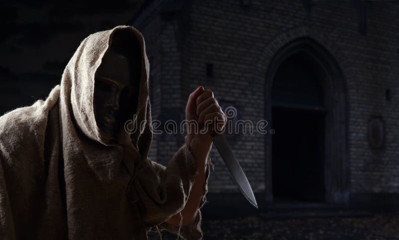 Man in Iron Mask with Knife Stock Photo - Image of horror, danger: 77592186