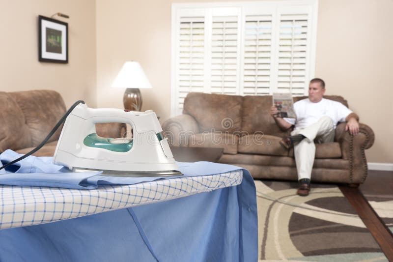 Man ironing shirt stock photo. Image of incompetence - 17842960