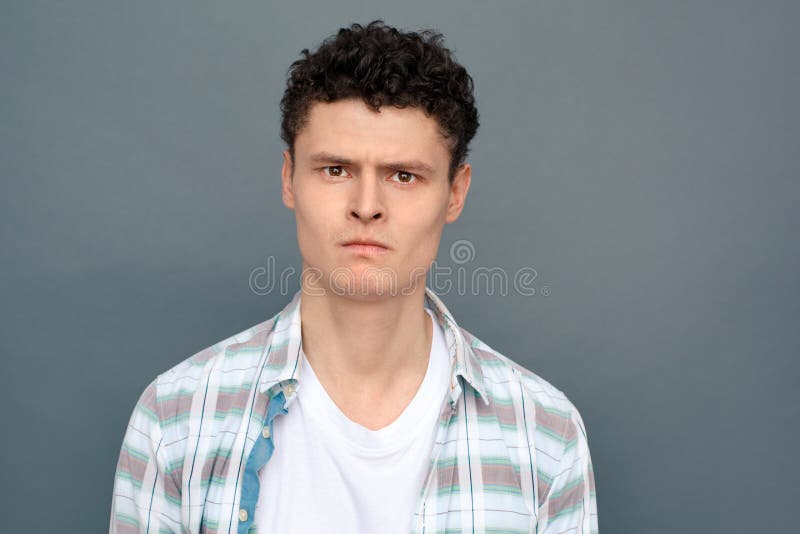 Man Isolated on Gray Wall Free Style Looking Camera Moody Stock Image ...