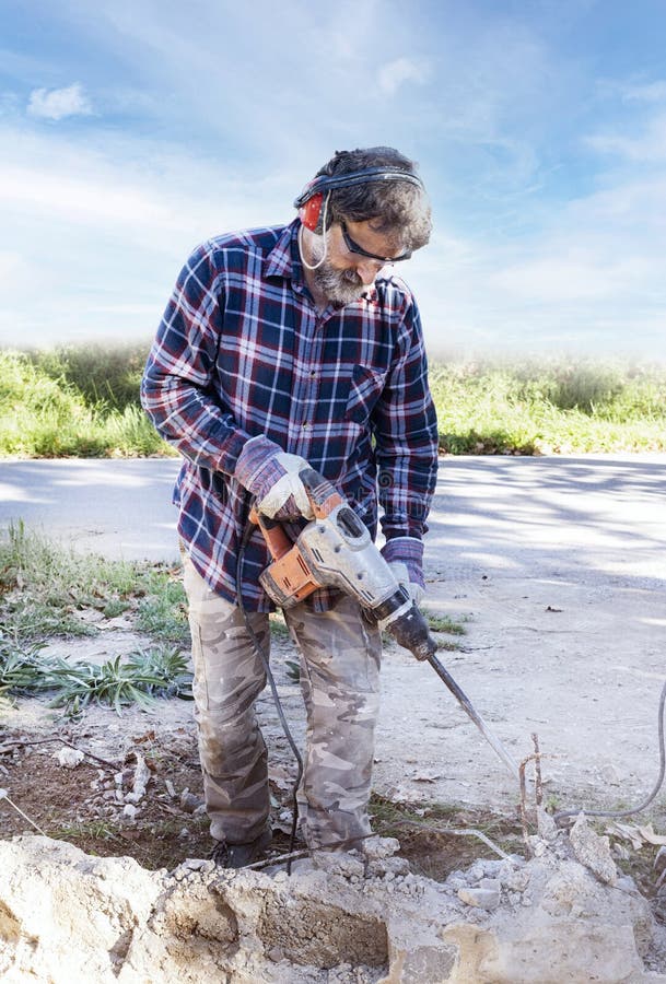Man and jackhammer stock image. Image of workman, building - 261178277