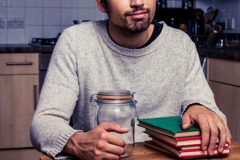 Man with Jam Jar and Stack of Books Stock Photo - Image of literature ...