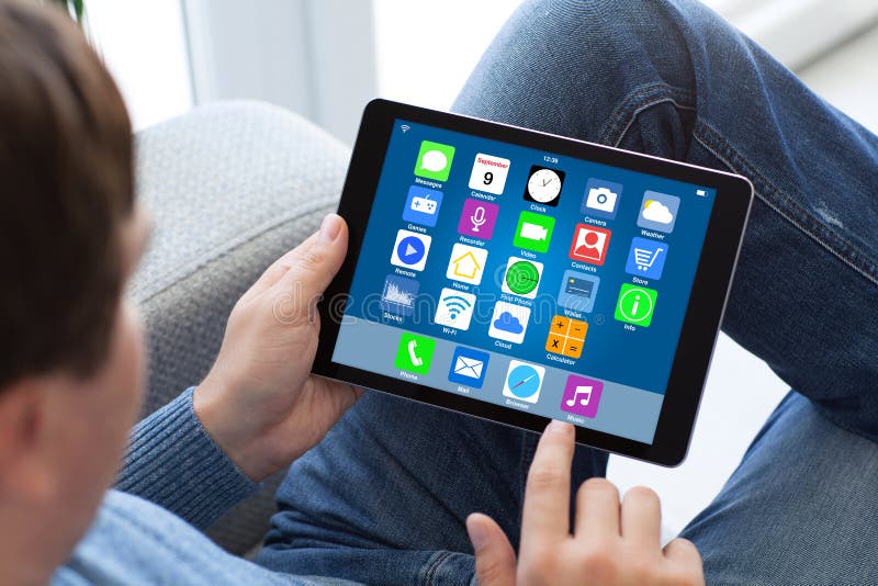Man Jeans Holding Tablet Computer with Home Screen Icons Apps Stock ...